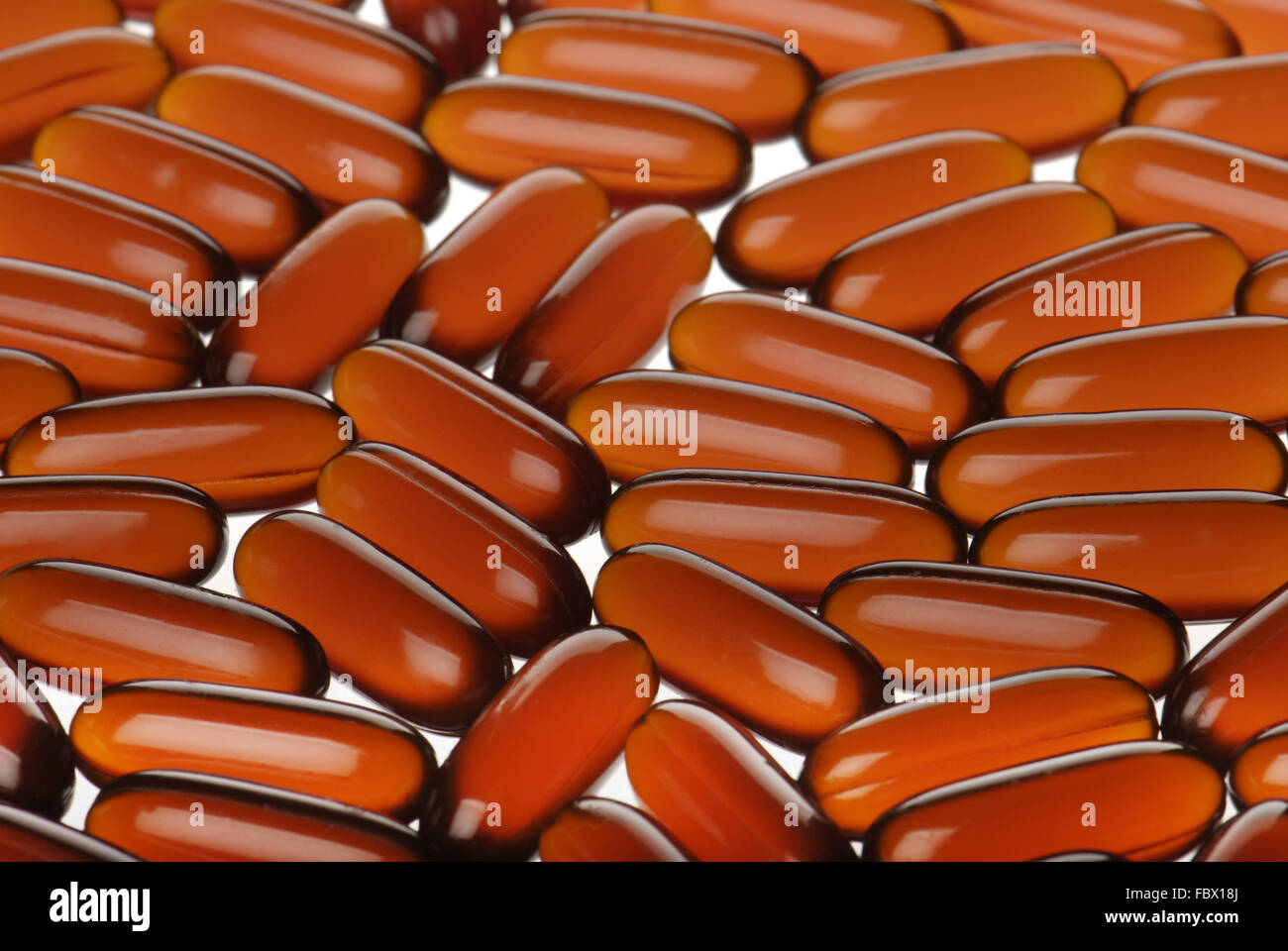 closeup bright orange capsules background Stock Photo - Alamy
