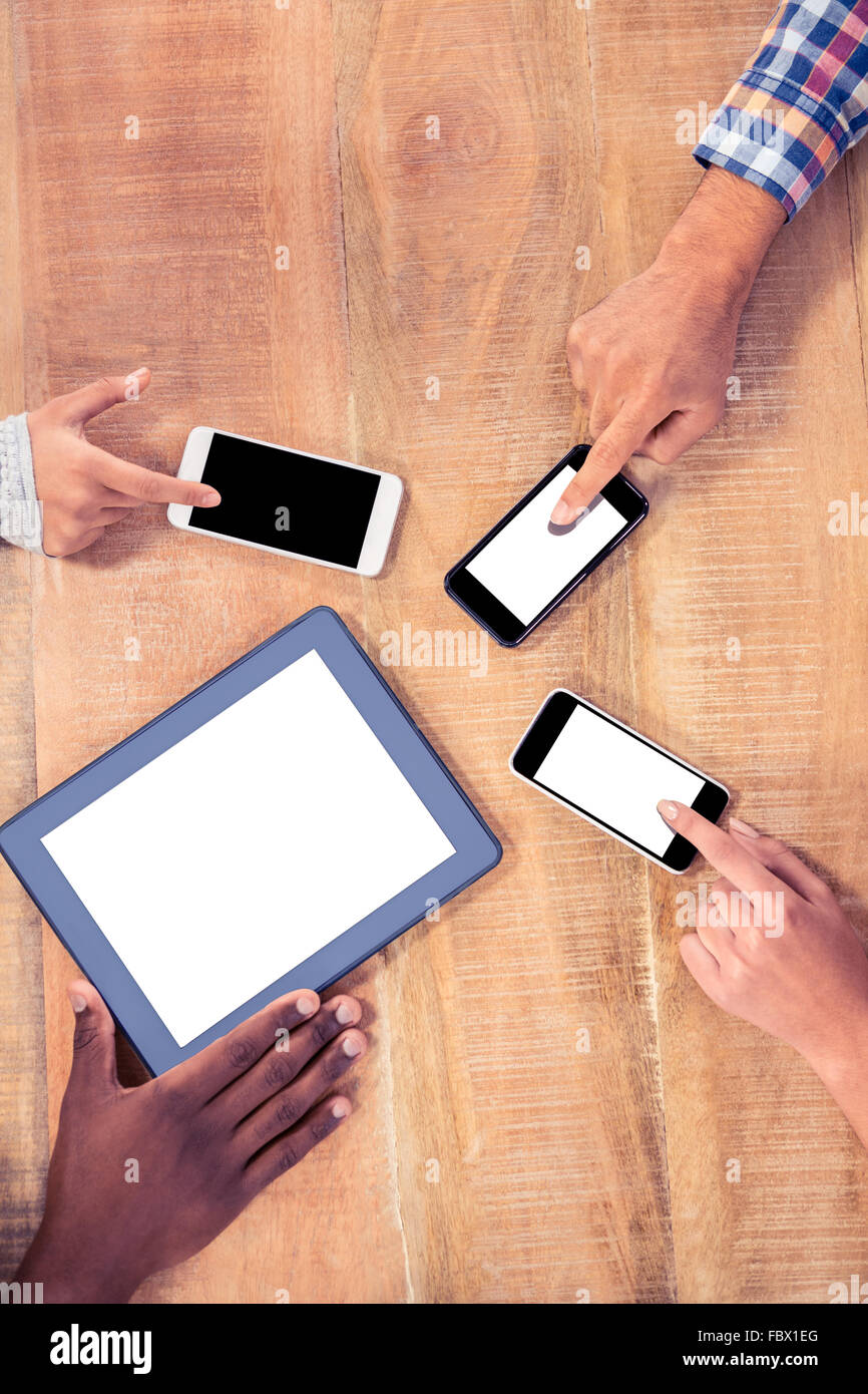 Business colleagues using technologies at desk Stock Photo - Alamy