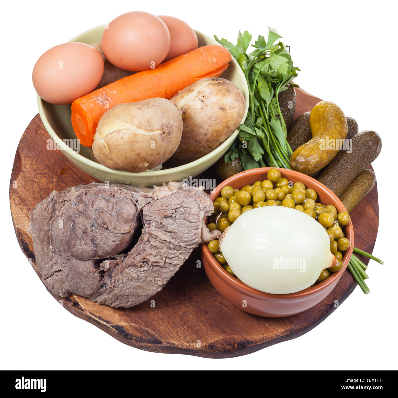 boiled ingredients for russian salad cooking on wooden board isolated ...