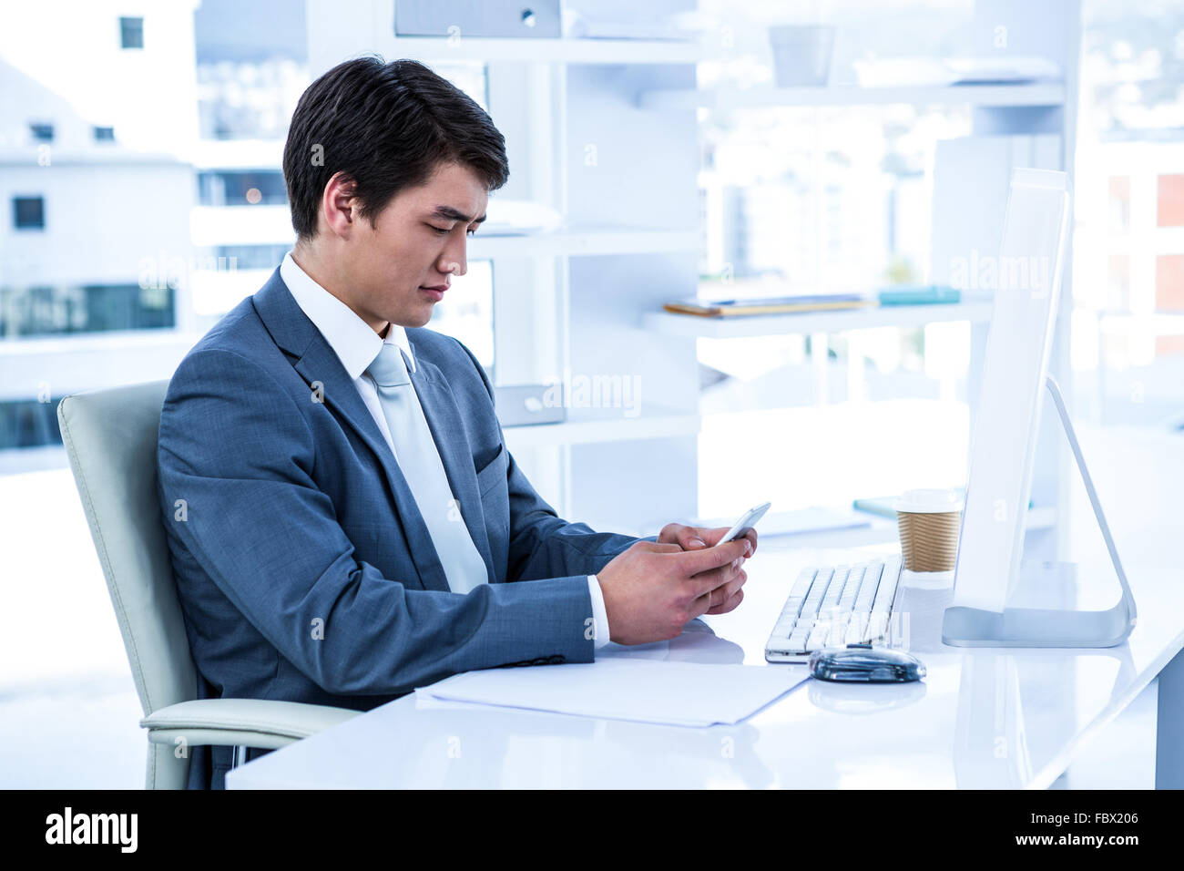 Asian businessman using mobile smartphone hi-res stock photography and ...