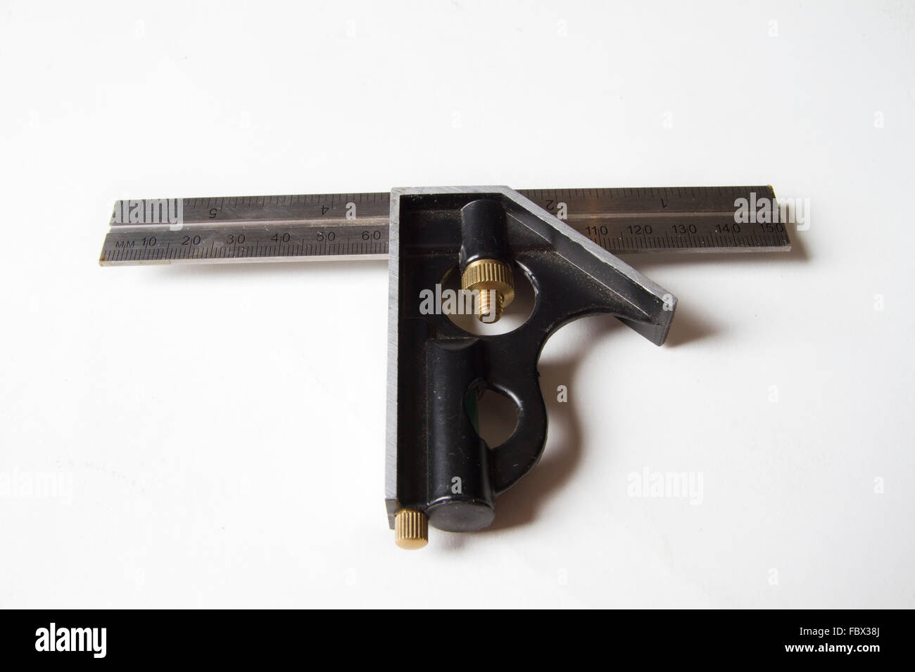 A combination Square with a built in 45 degree angle used in metal and ...