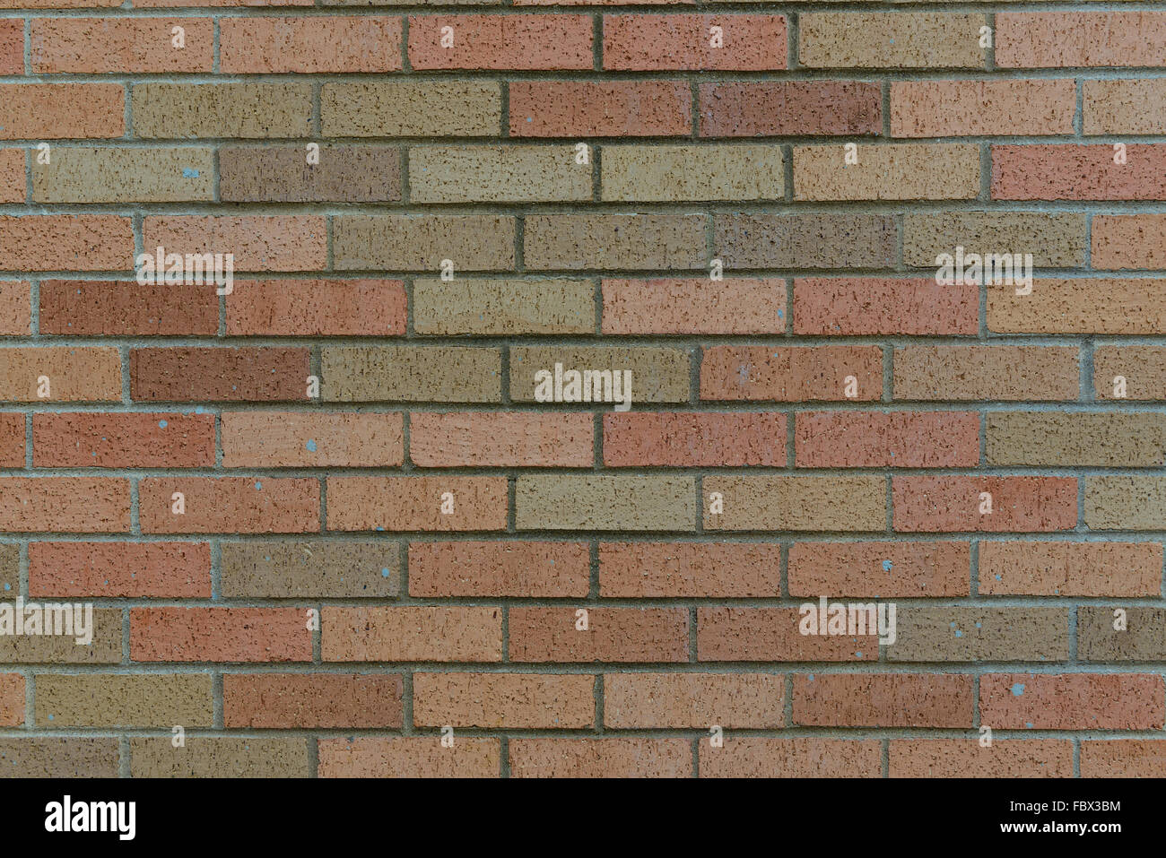 background of random orange green tone brick wall, pattern, close up ...