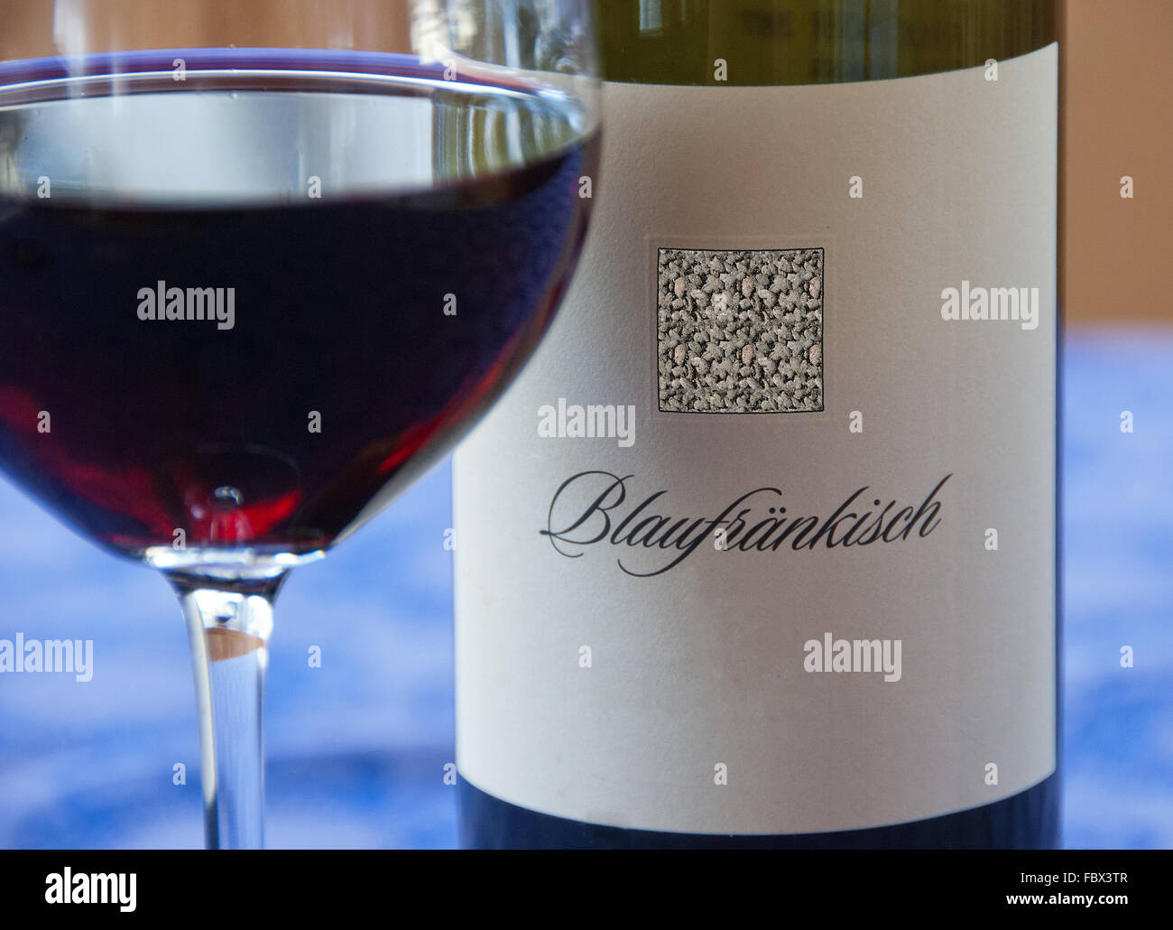 Bottle and win glass with red wine Stock Photo - Alamy