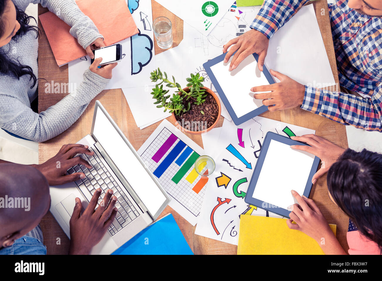 Business colleagues using technologies at desk Stock Photo - Alamy