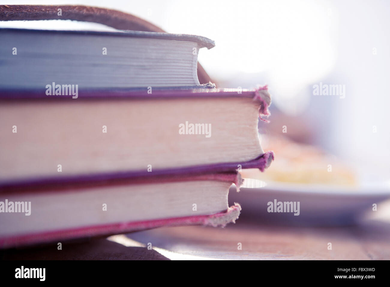 Stack of books on table office Stock Photo - Alamy