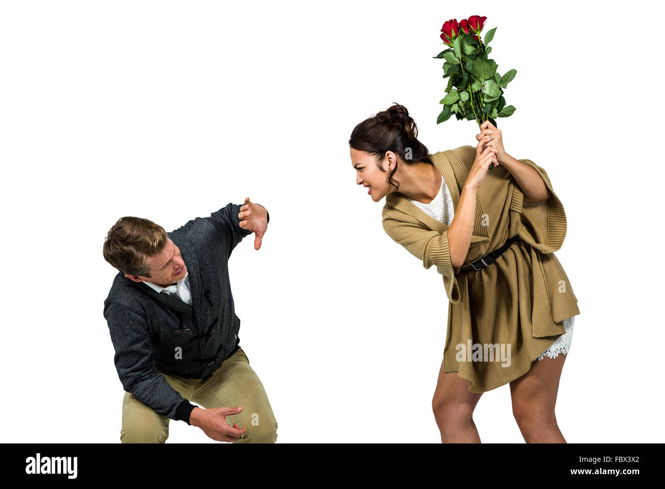 Woman hitting boyfriend with red flowers Stock Photo - Alamy