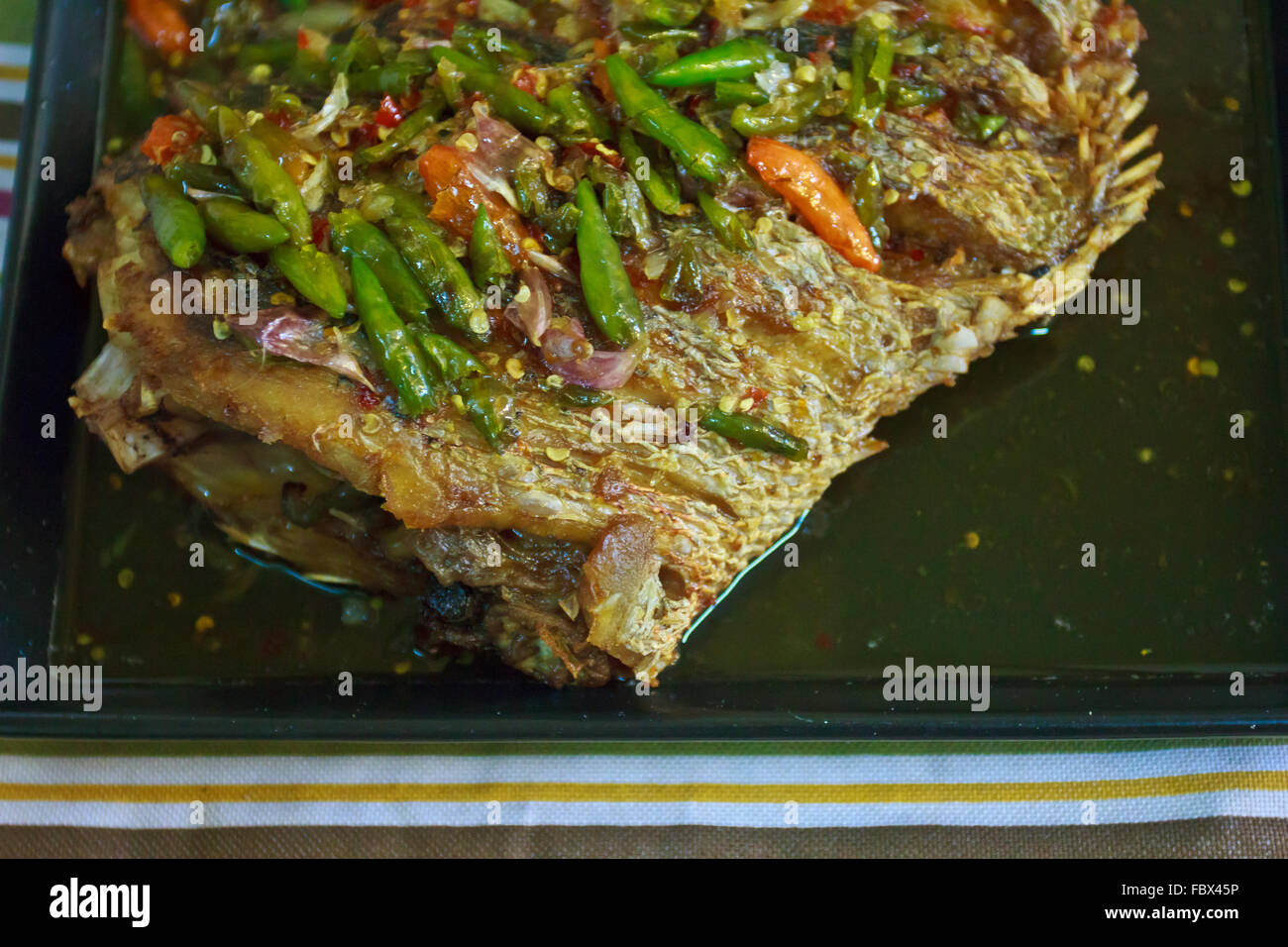 fried fish with garlic and chili 2 Stock Photo - Alamy