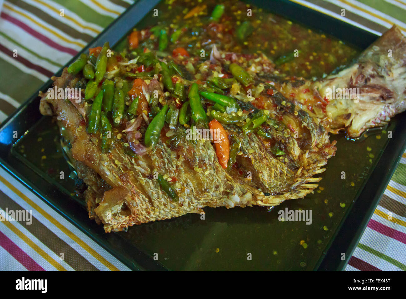 fried fish with garlic and chili 5 Stock Photo - Alamy