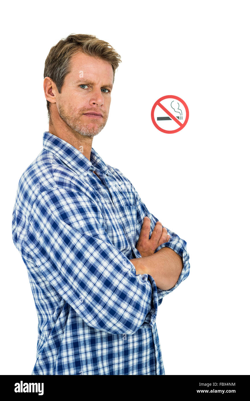 Man standing cigarette crossed arms hi-res stock photography and images ...