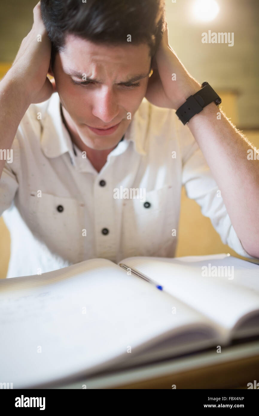 Anxious male student during exam Stock Photo - Alamy