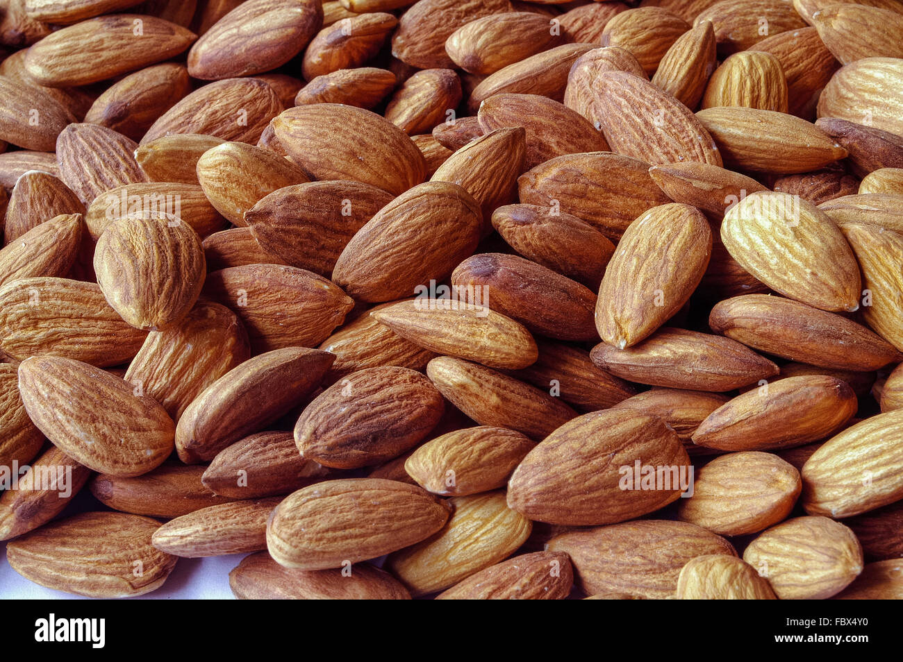 Almond Seed background Stock Photo - Alamy