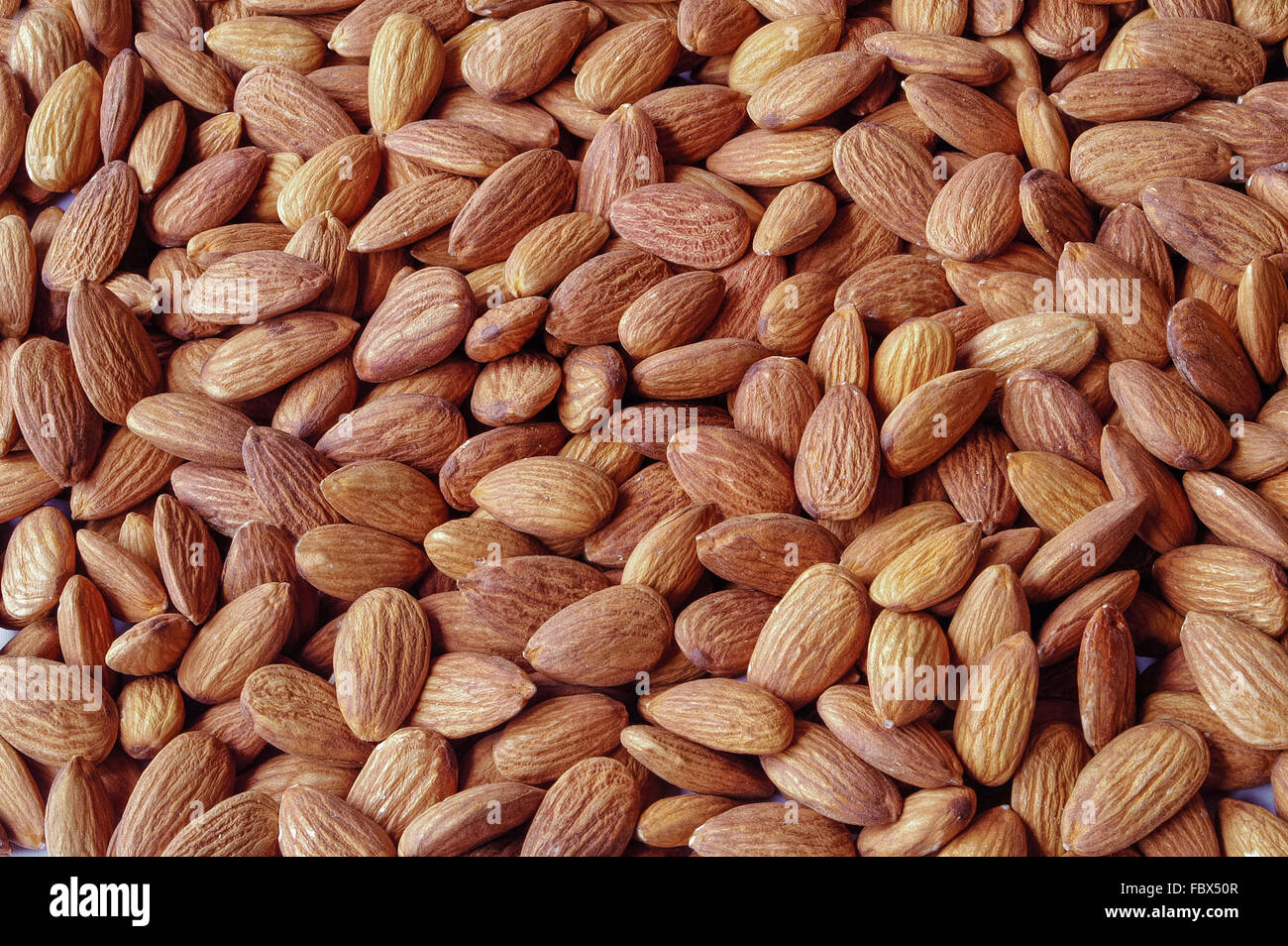 Almond Seed background Stock Photo - Alamy