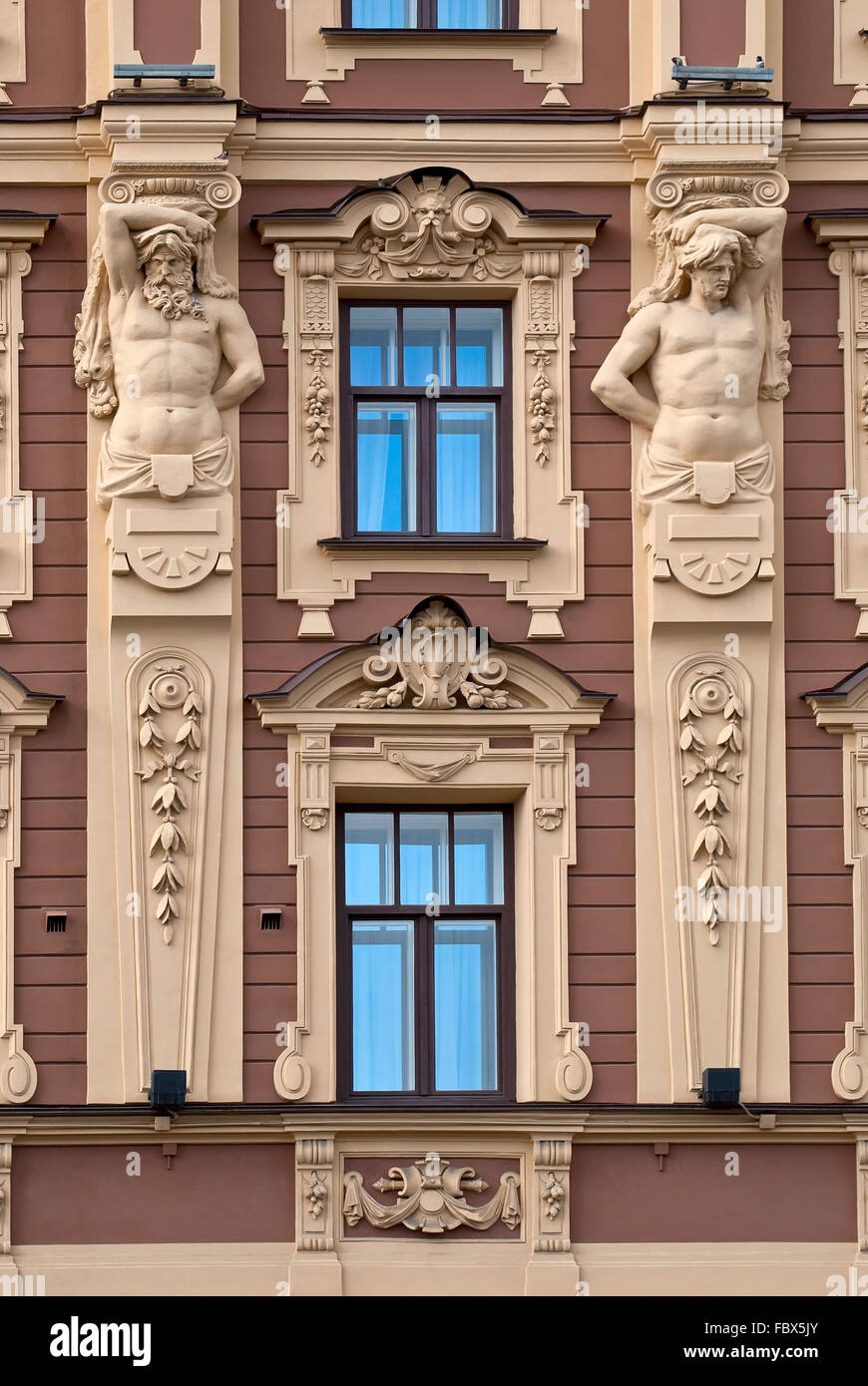 The facade of the building with antique sculptures Stock Photo - Alamy