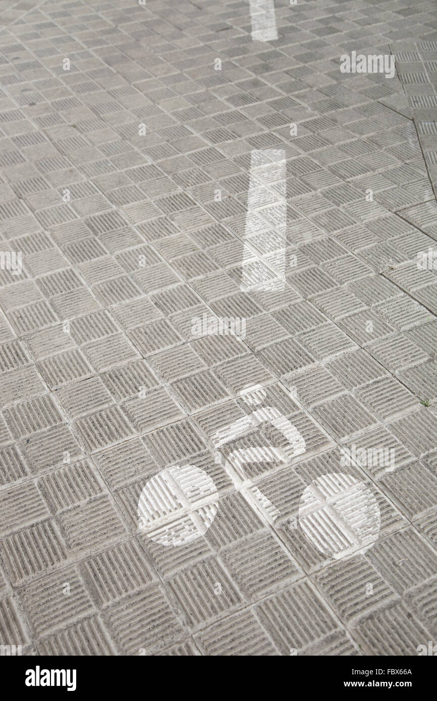 Bike Lane Symbol on Stone Pavement Stock Photo - Alamy