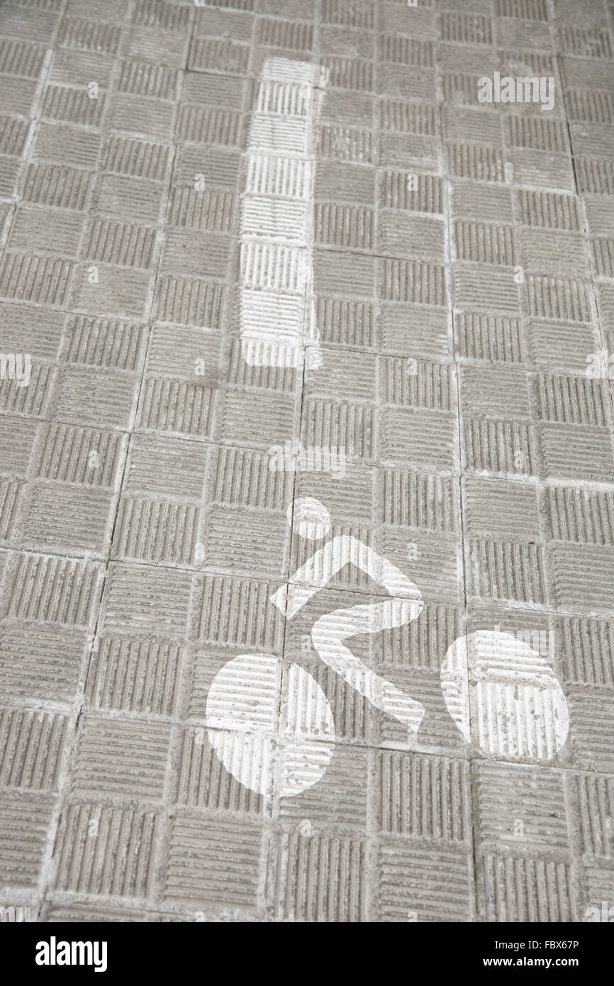 Bike Lane Symbol on Stone Pavement Stock Photo - Alamy