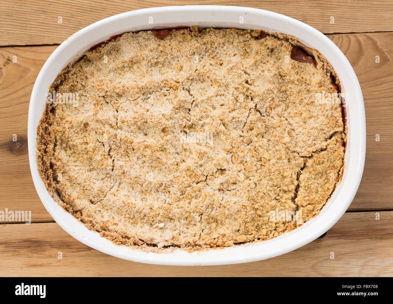 Traditional british apple crumble pie in dish Stock Photo - Alamy
