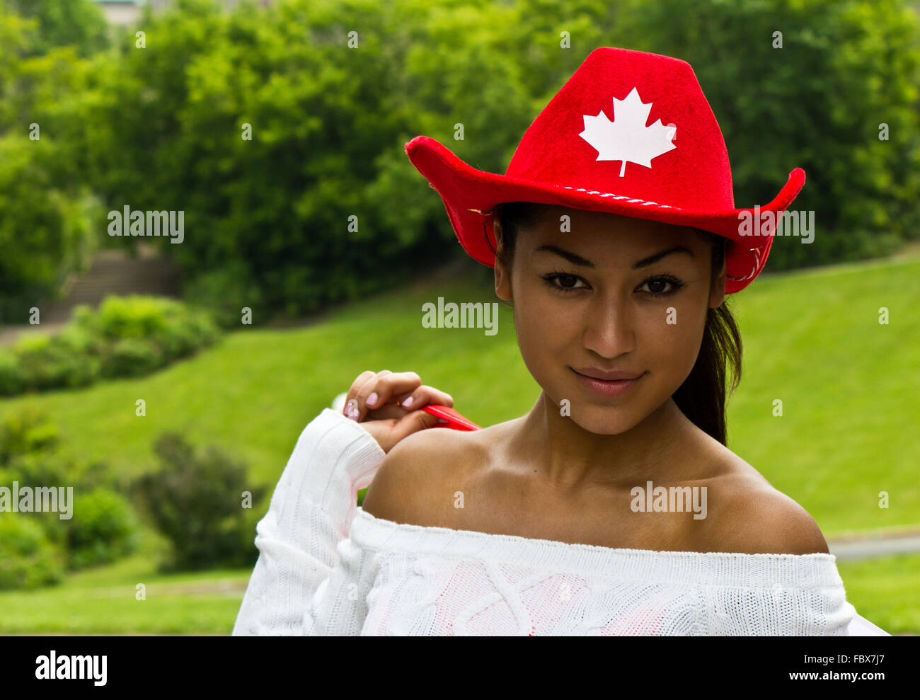 Pretty Canada girl with red cowboy hat Stock Photo - Alamy