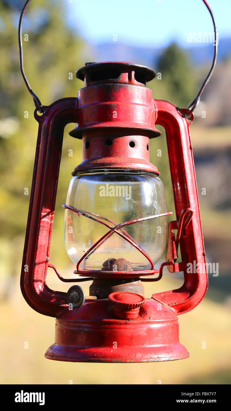 vintage old red lantern in the mountains Stock Photo - Alamy