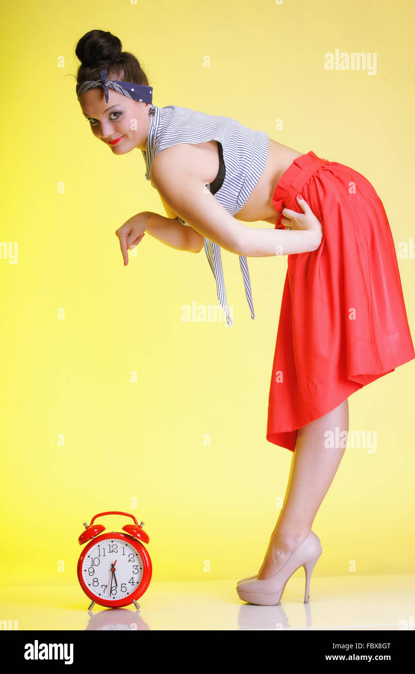 Woman with red clock. Time management concept Stock Photo - Alamy