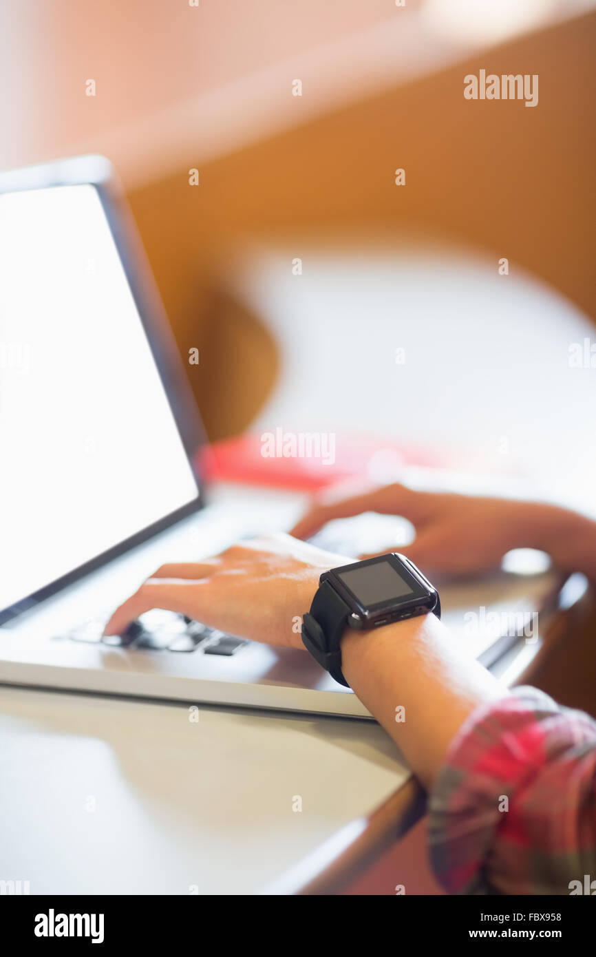 Smiling female student using laptop Stock Photo - Alamy