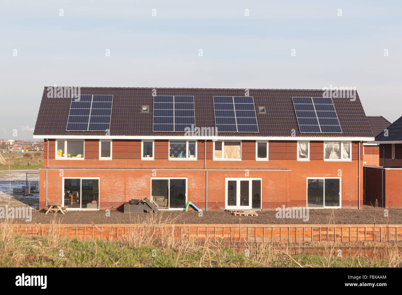 Family homes with solar panels Stock Photo - Alamy