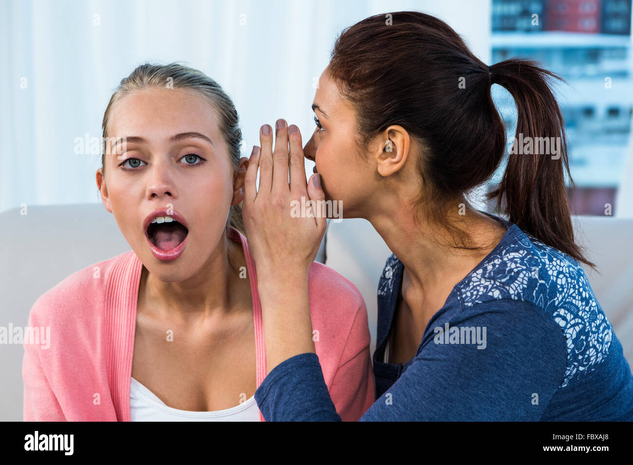 Telling secrets hi-res stock photography and images - Alamy
