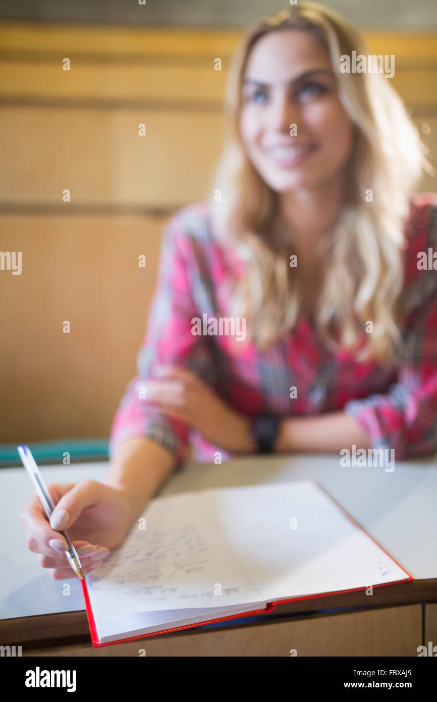 Smiling female student during class Stock Photo - Alamy