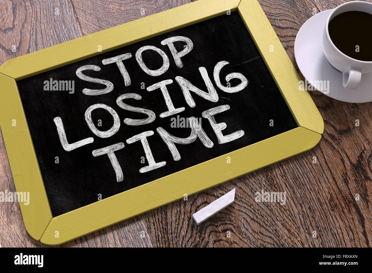 Stop Losing Time Handwritten on Chalkboard Stock Photo - Alamy