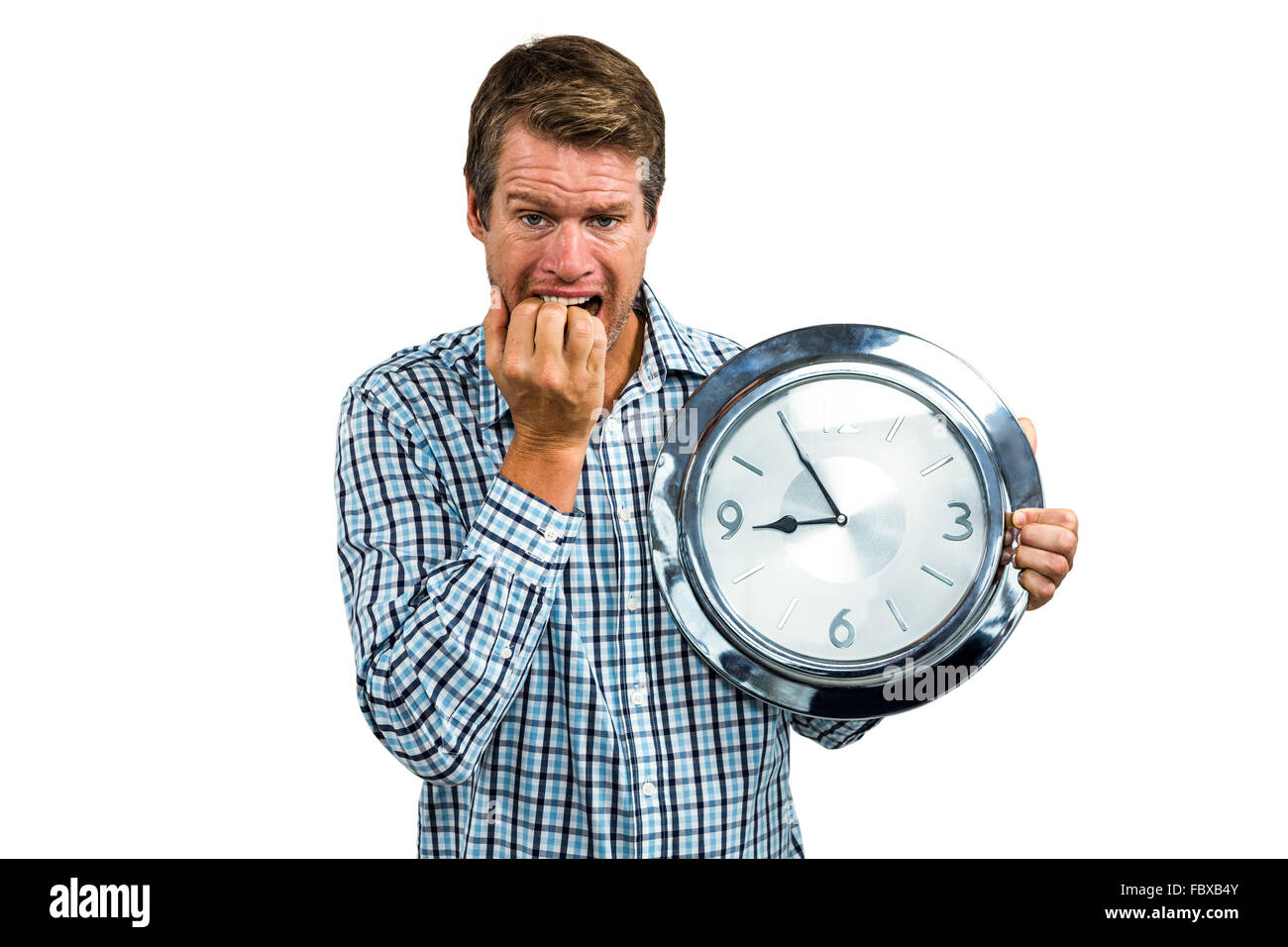 Anxious late man holding a clock Stock Photo - Alamy