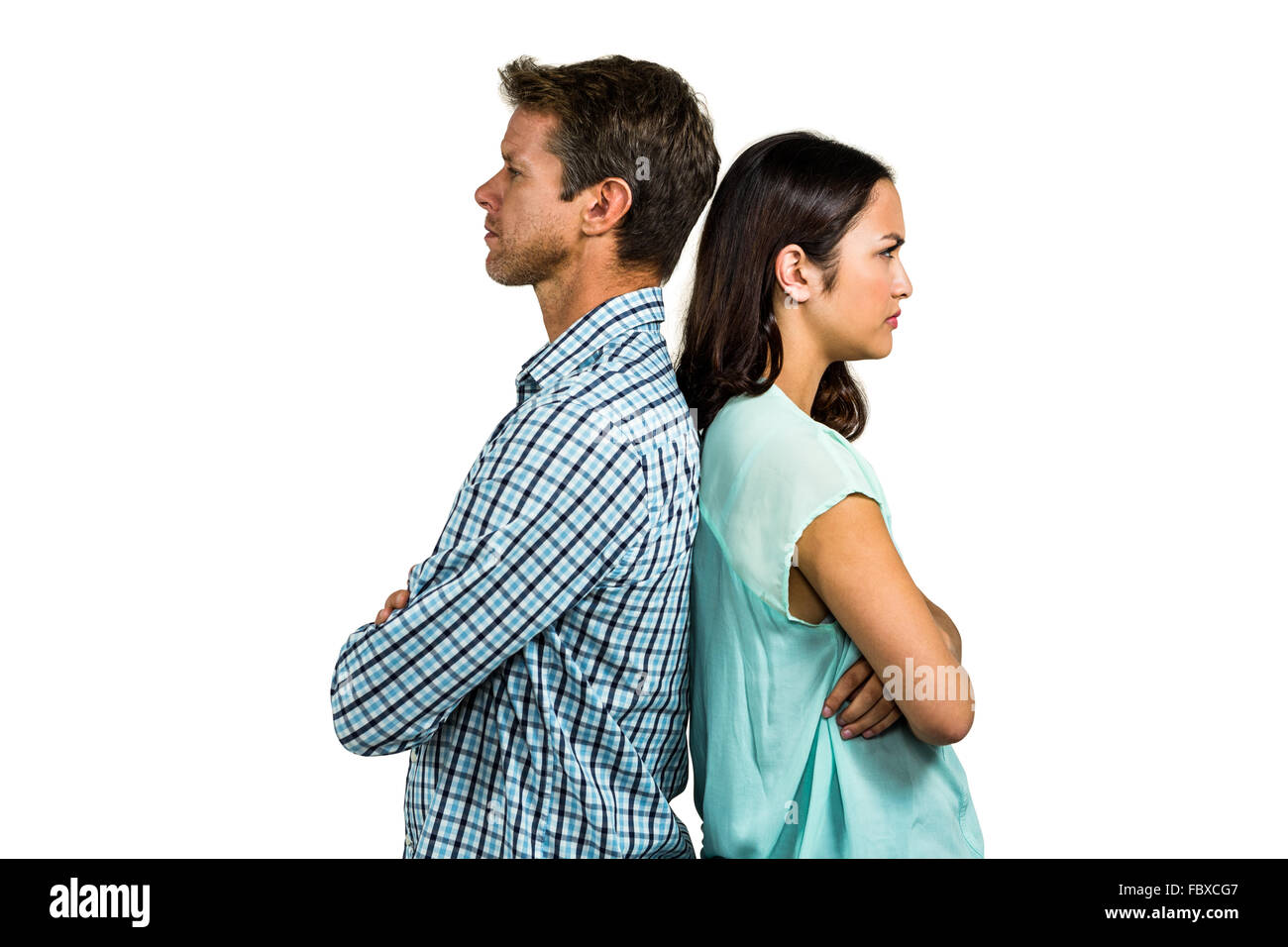 Angry couple standing back to back Stock Photo - Alamy
