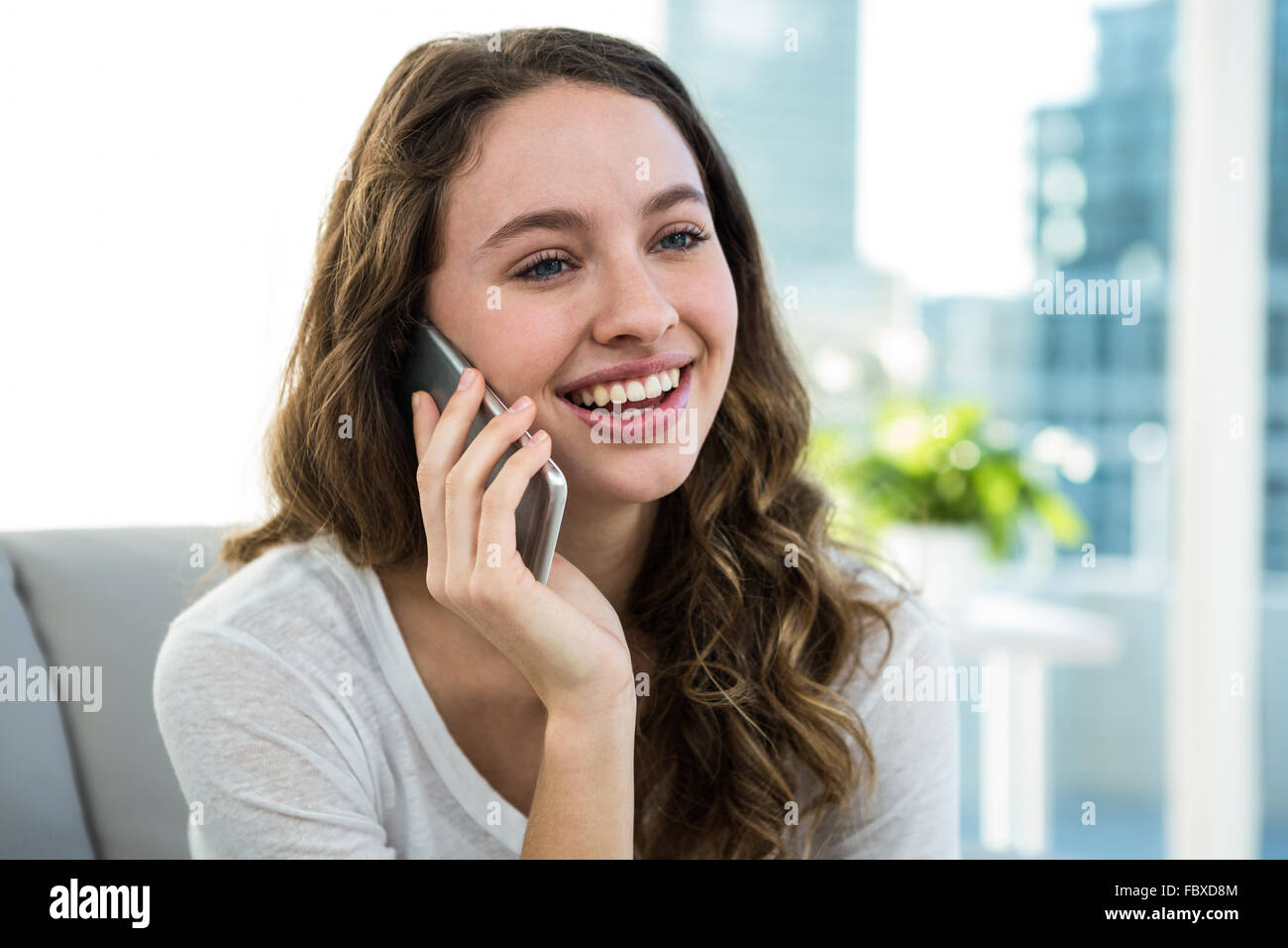 Happy woman calling Stock Photo - Alamy