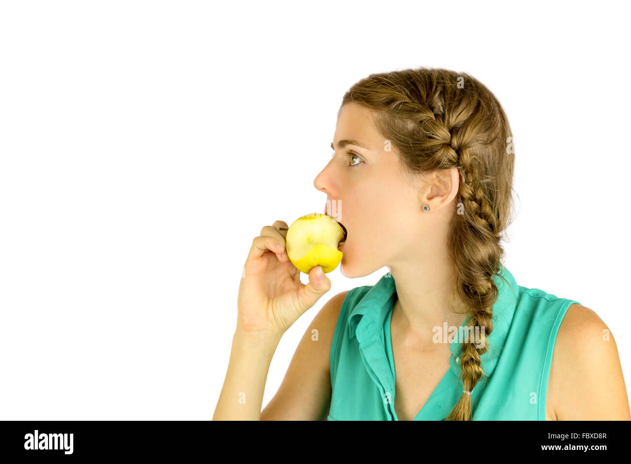 Girl taking a bite of an apple Stock Photo - Alamy