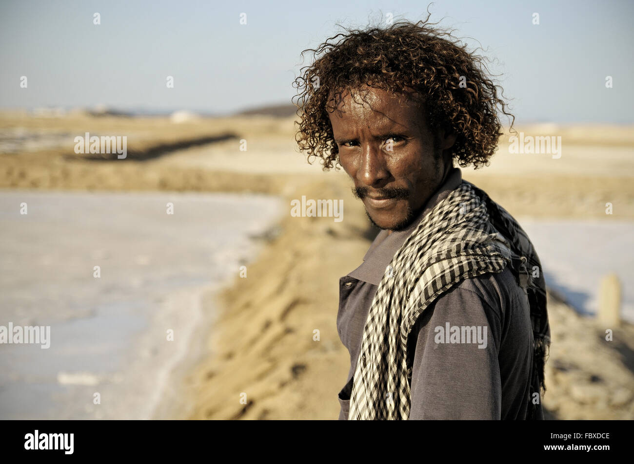 African Afar man in a salt pans on the shore of Lake Afrera, Afar ...