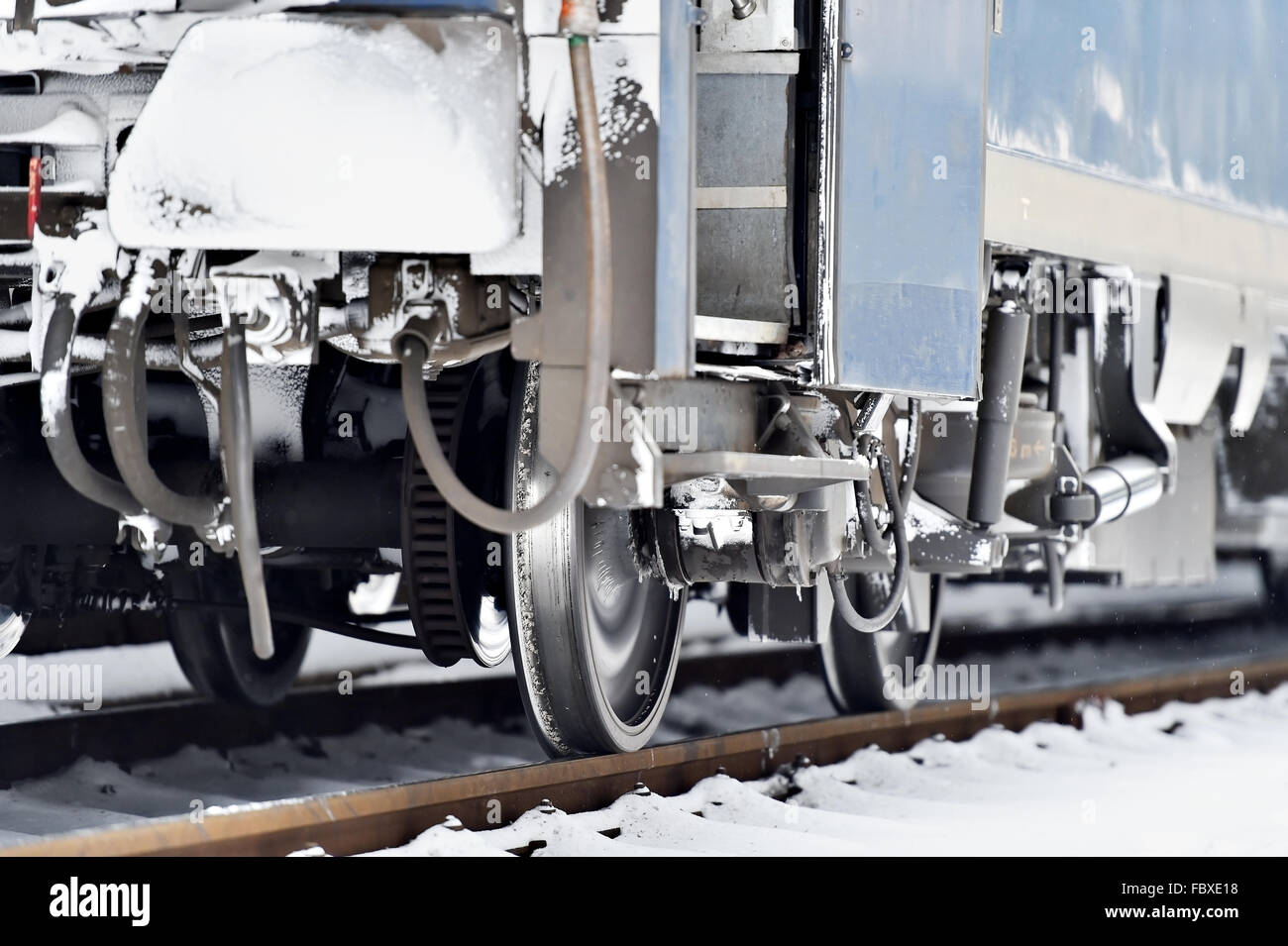 Detail shot with frozen train wagon buffers, connection links and ...
