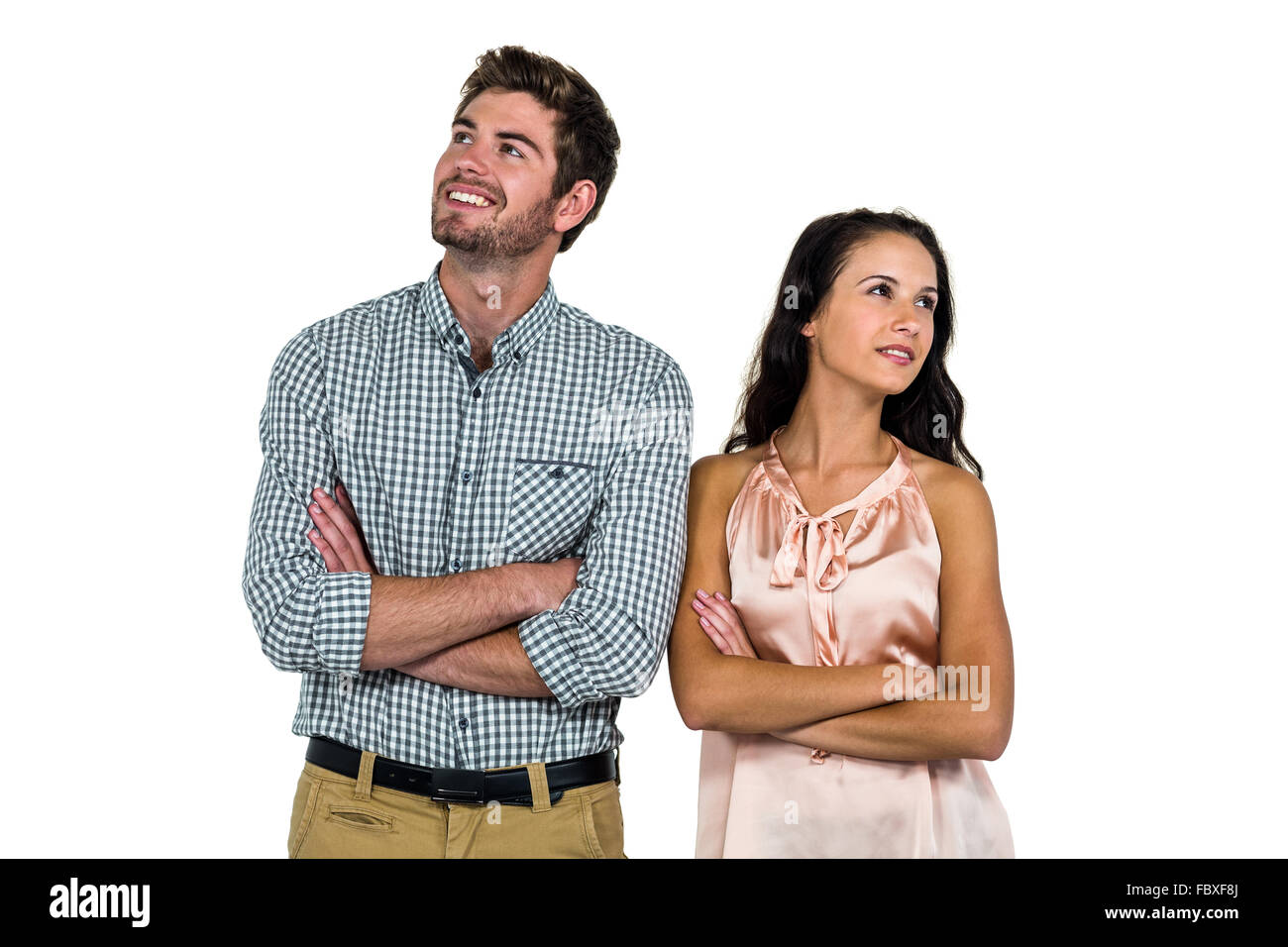 Smiling couple with arms crossed Stock Photo - Alamy