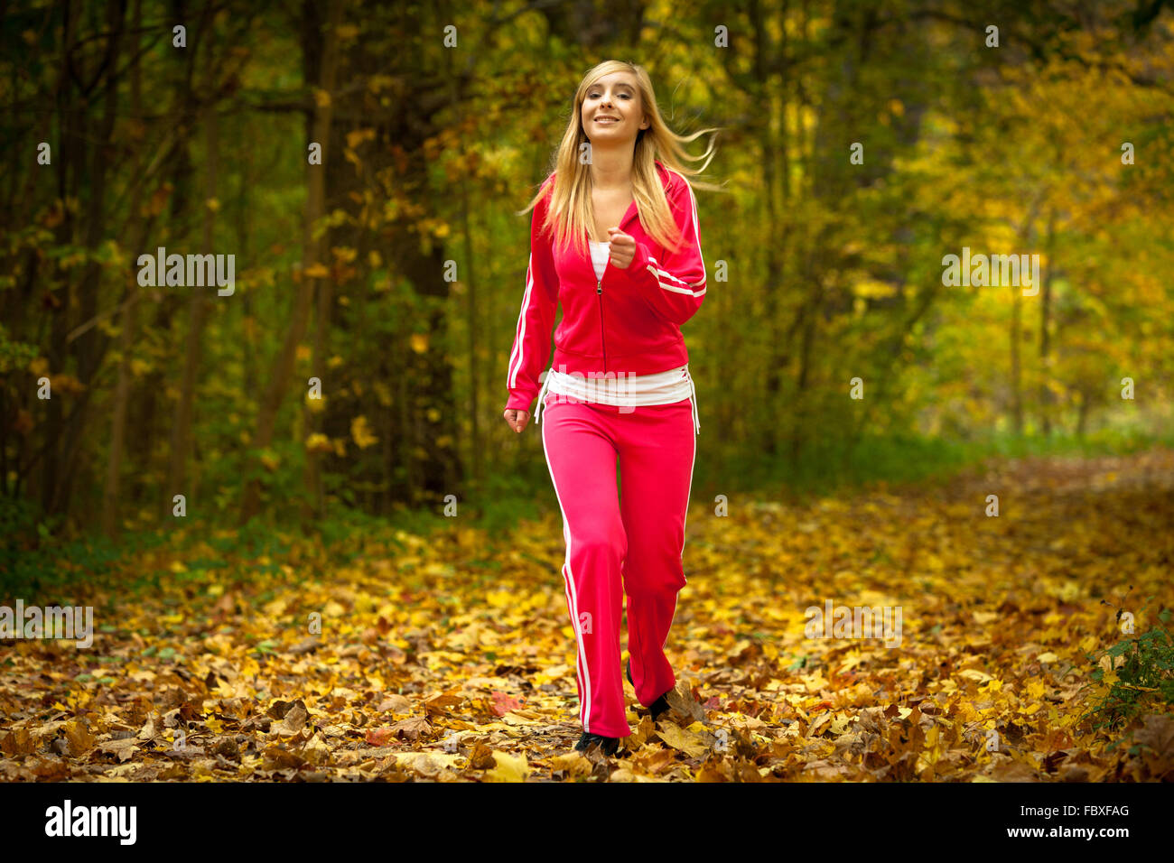 Blonde girl walking outside hi-res stock photography and images - Alamy