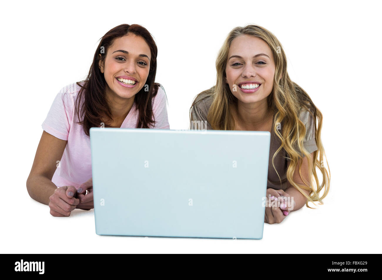 Two girls using a laptop Stock Photo - Alamy