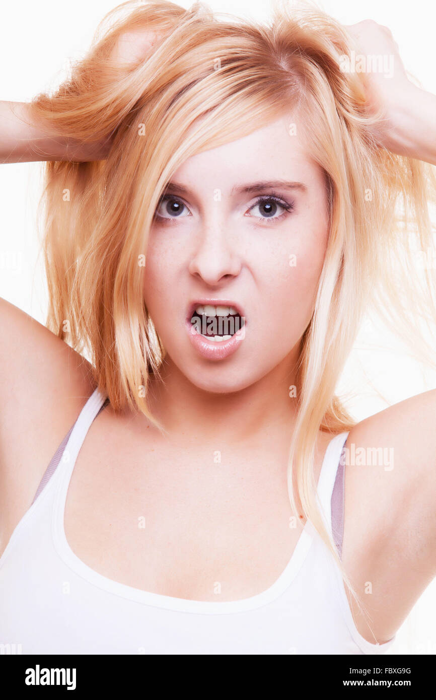 Stressed woman pulling hair hi-res stock photography and images - Alamy
