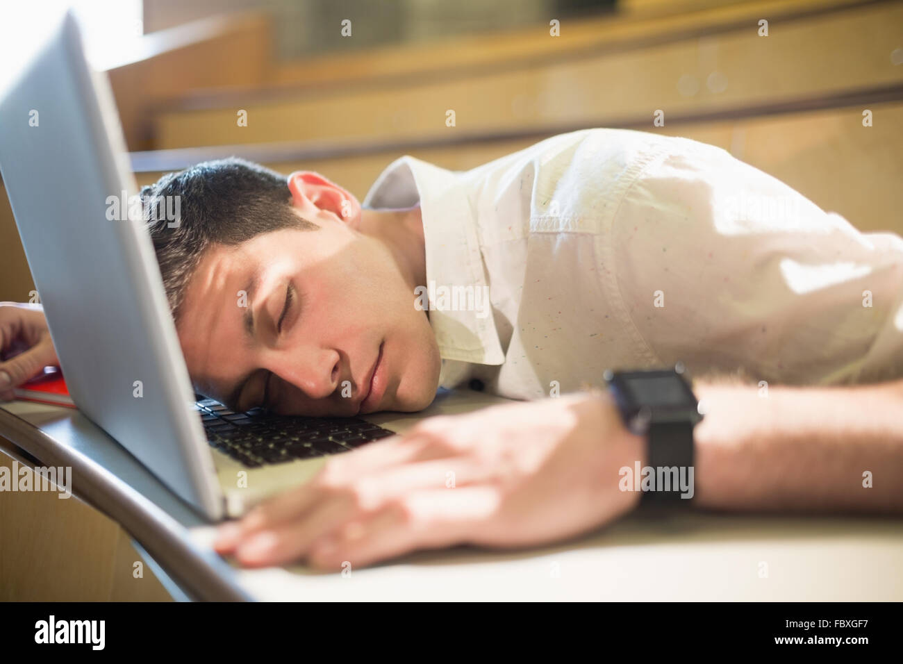 Male student falling asleep during class Stock Photo - Alamy