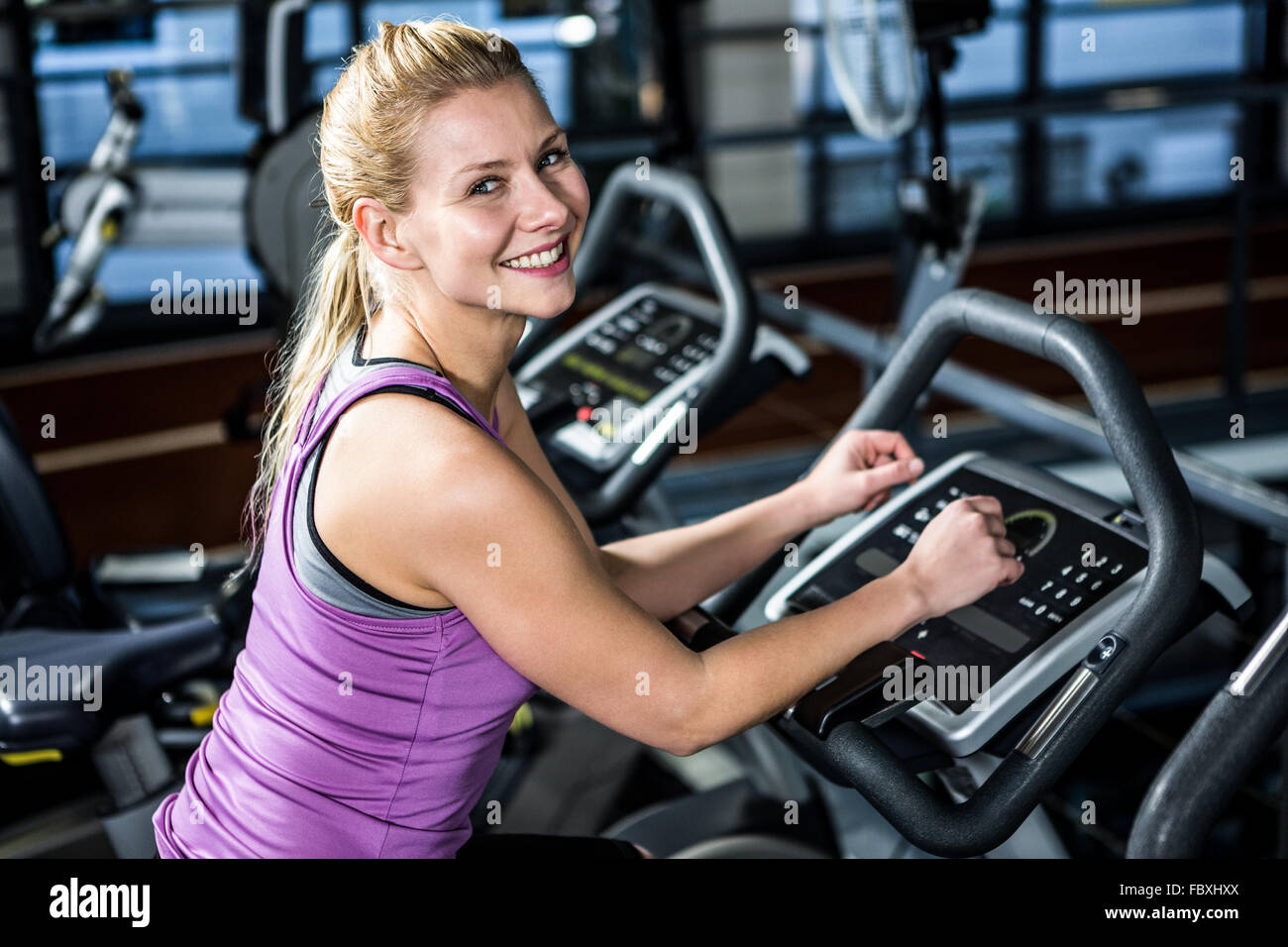 Woman exercise bike gym hi-res stock photography and images - Alamy