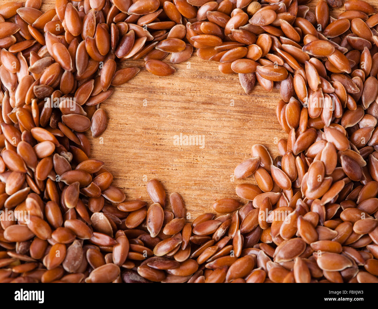 Healthy diet. Flax seeds linseed border on wooden background Stock Photo - Alamy