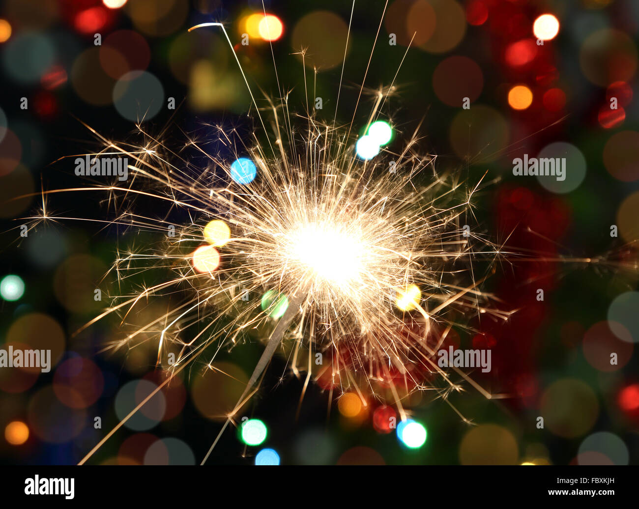 yellow sparkler holiday background on black Stock Photo - Alamy