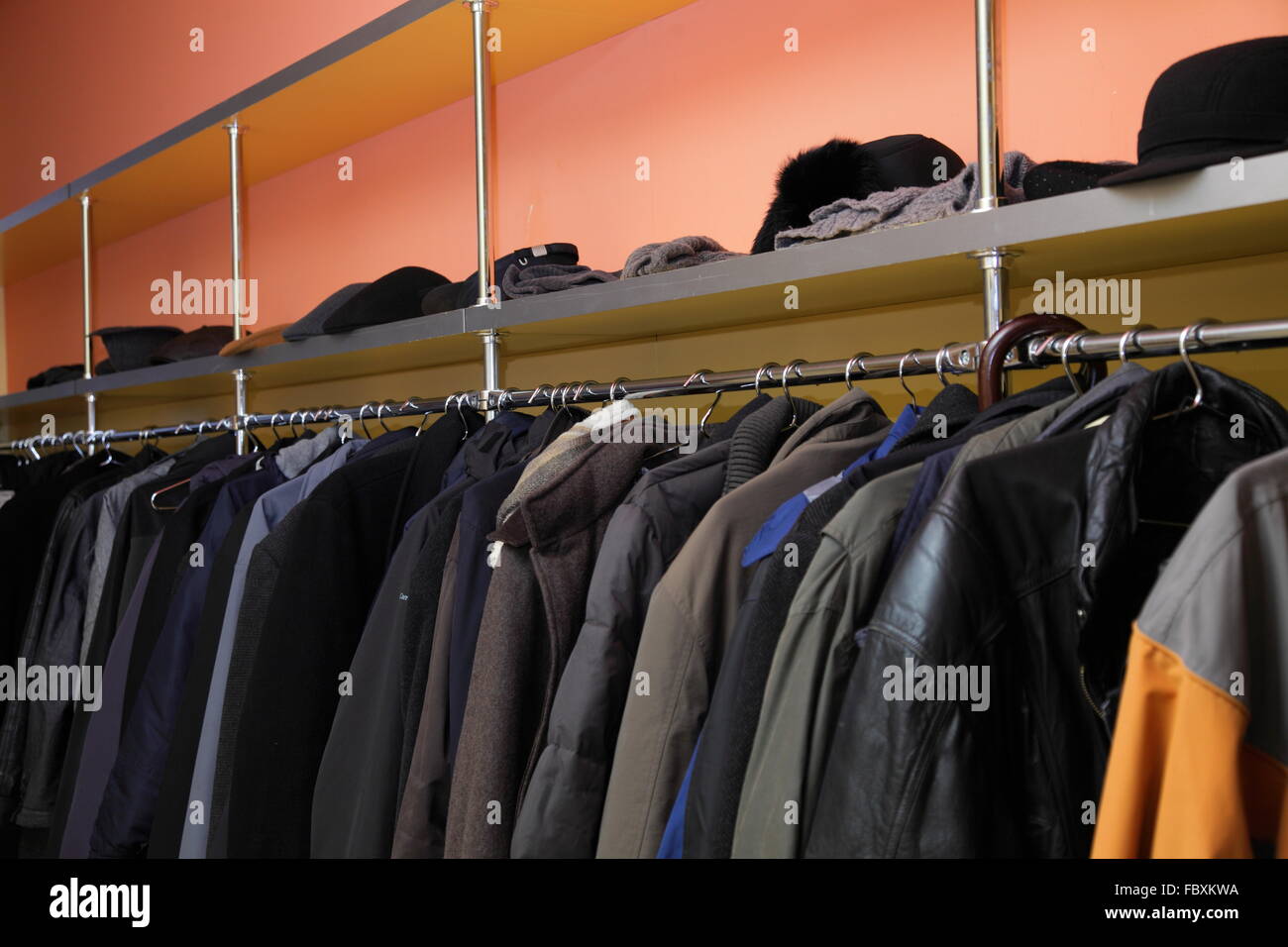 Many clothes in cloakroom Stock Photo - Alamy