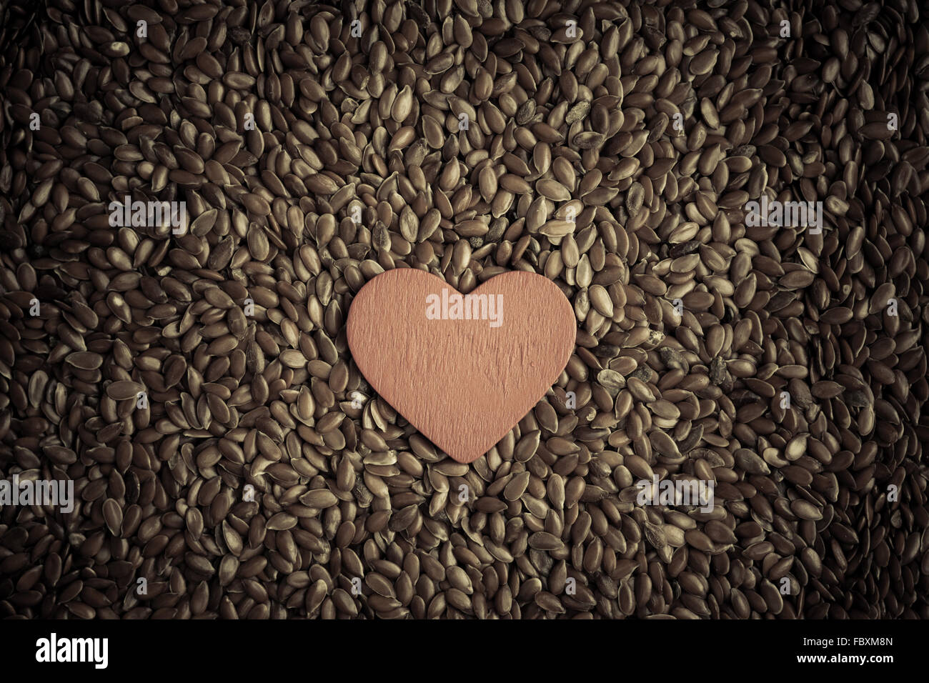 Healthy diet. Flax seeds linseed as food background and red heart Stock Photo - Alamy