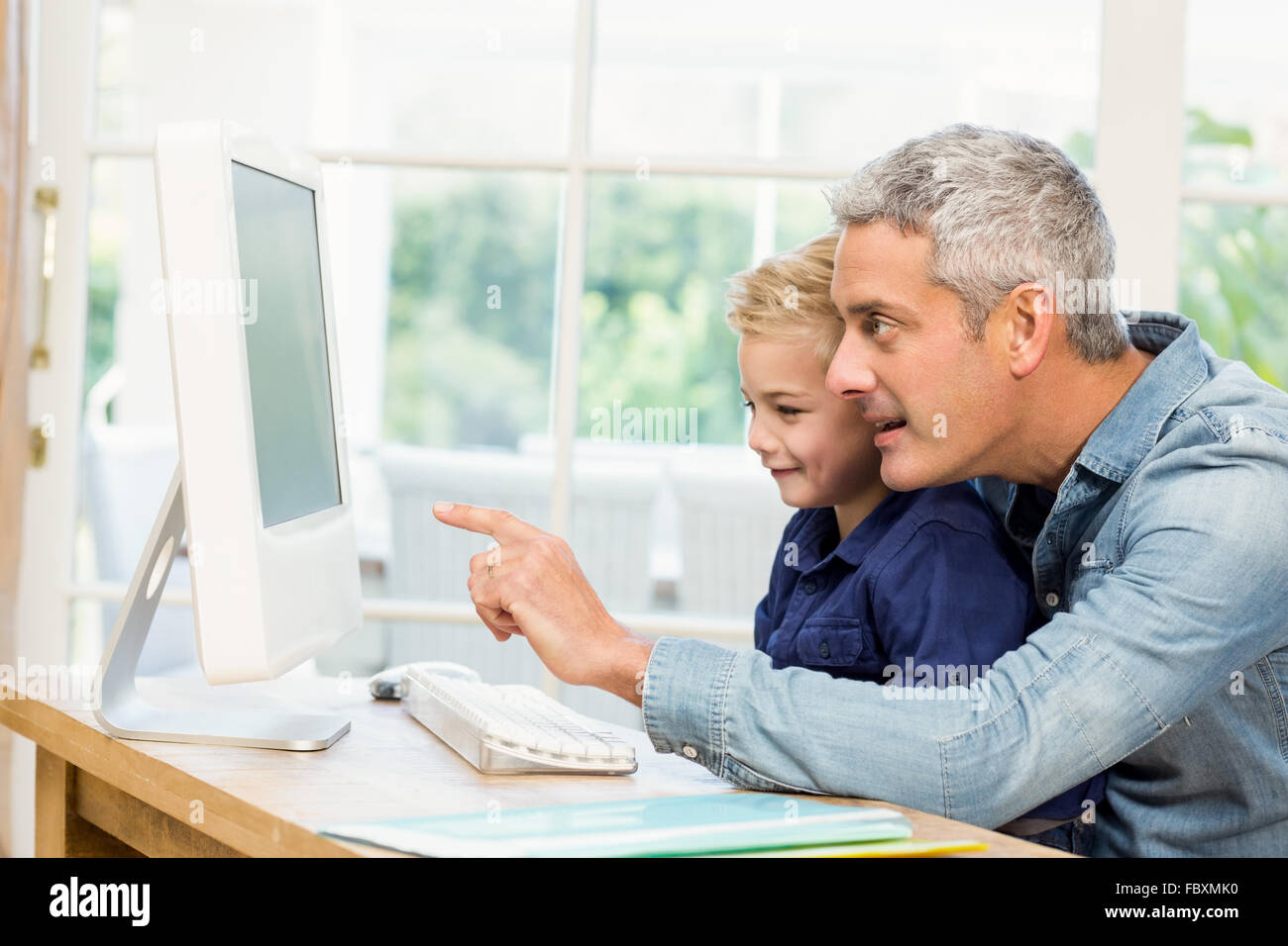 Father and son using the computer Stock Photo - Alamy