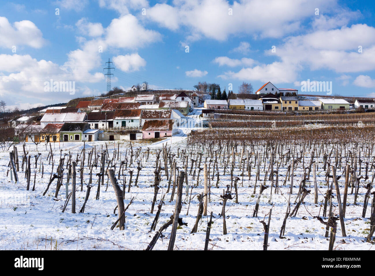 Snow covered wine cellars and vineyards on Mittelberg's Kellergasse in ...