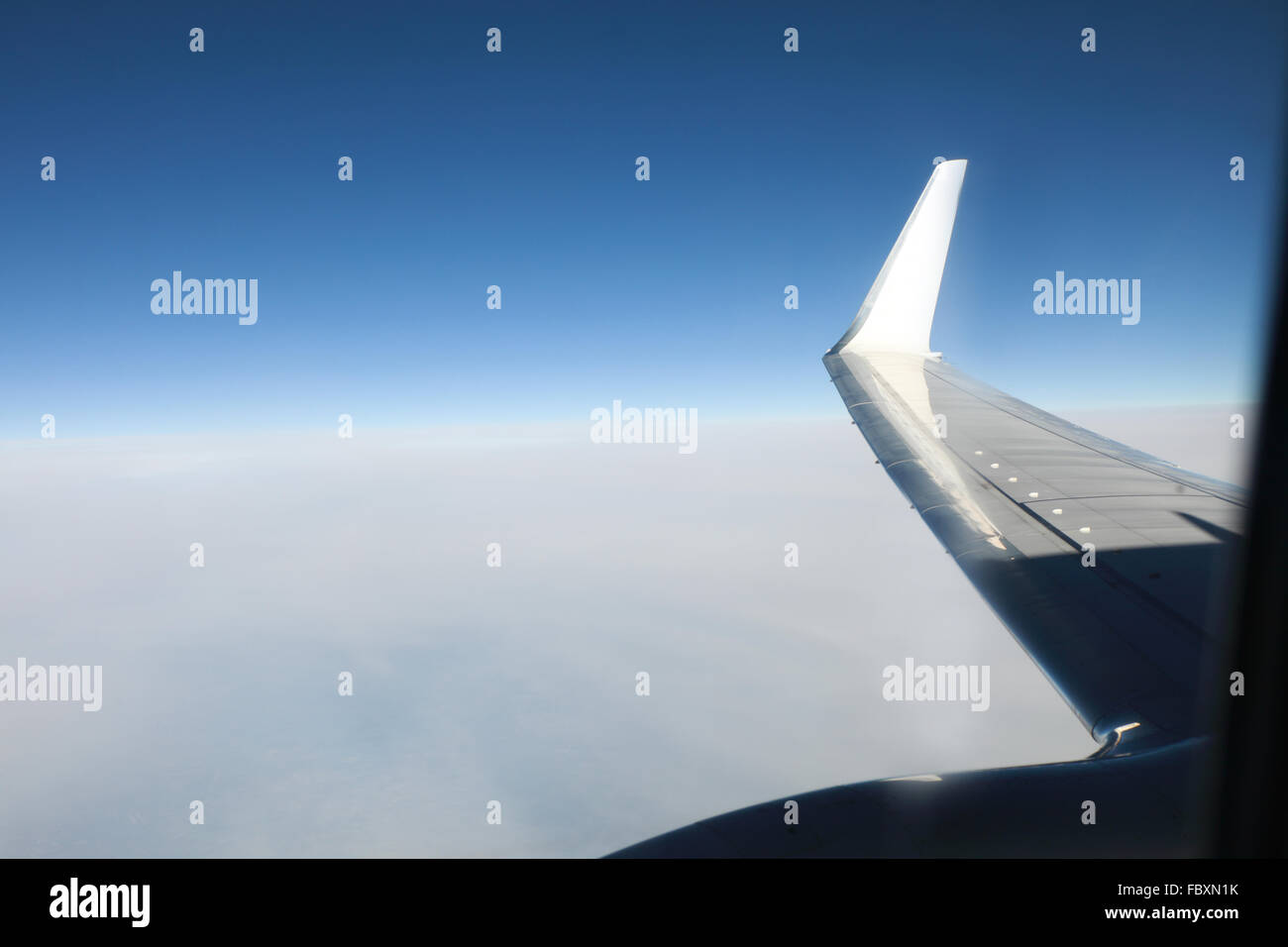 Airplane in the sky turbine and winks Stock Photo - Alamy