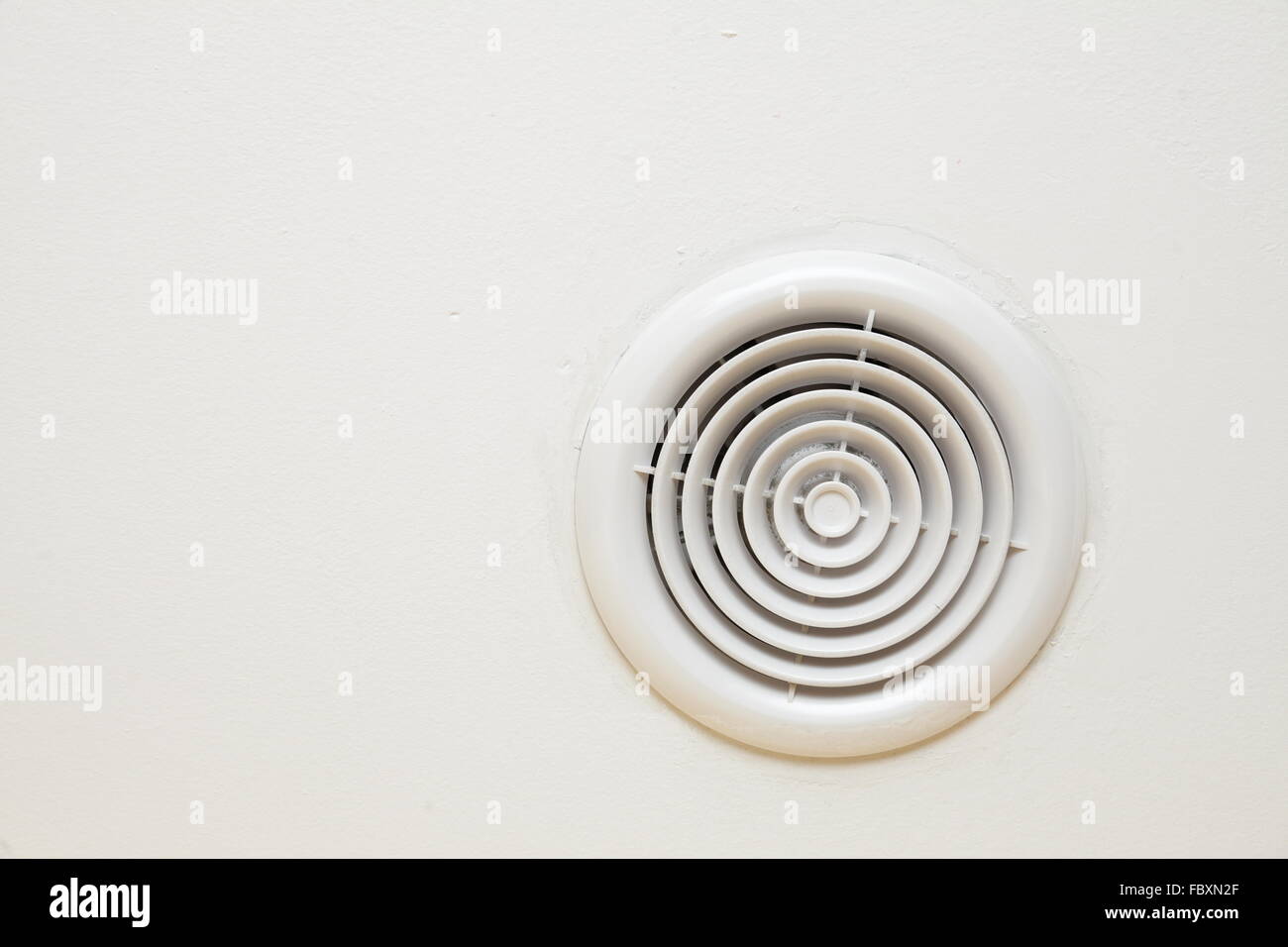 circular plastic air vent in white wall Stock Photo - Alamy
