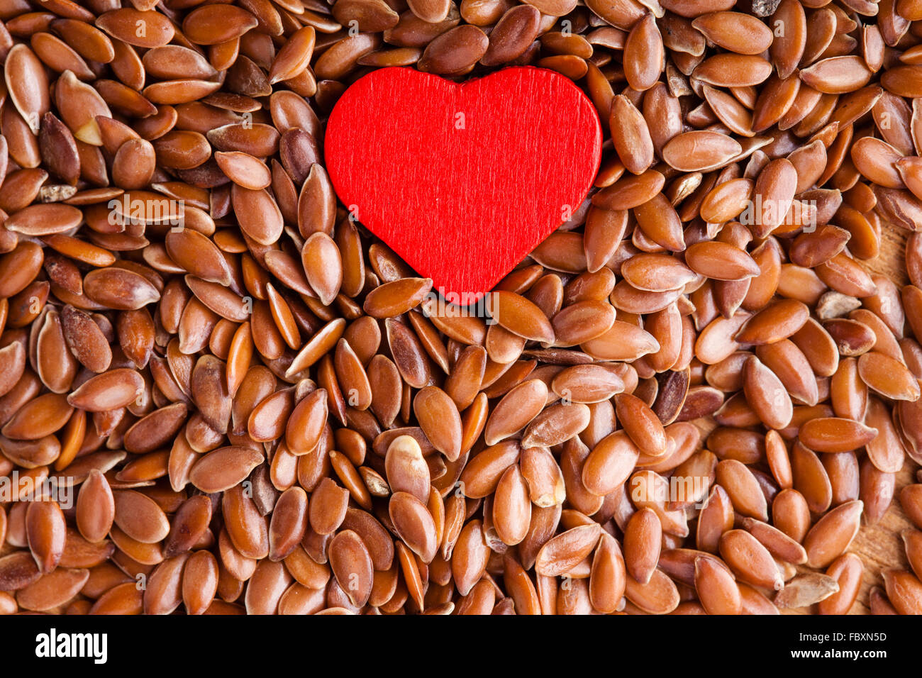 Healthy diet. Flax seeds linseed as food background and red heart Stock Photo - Alamy