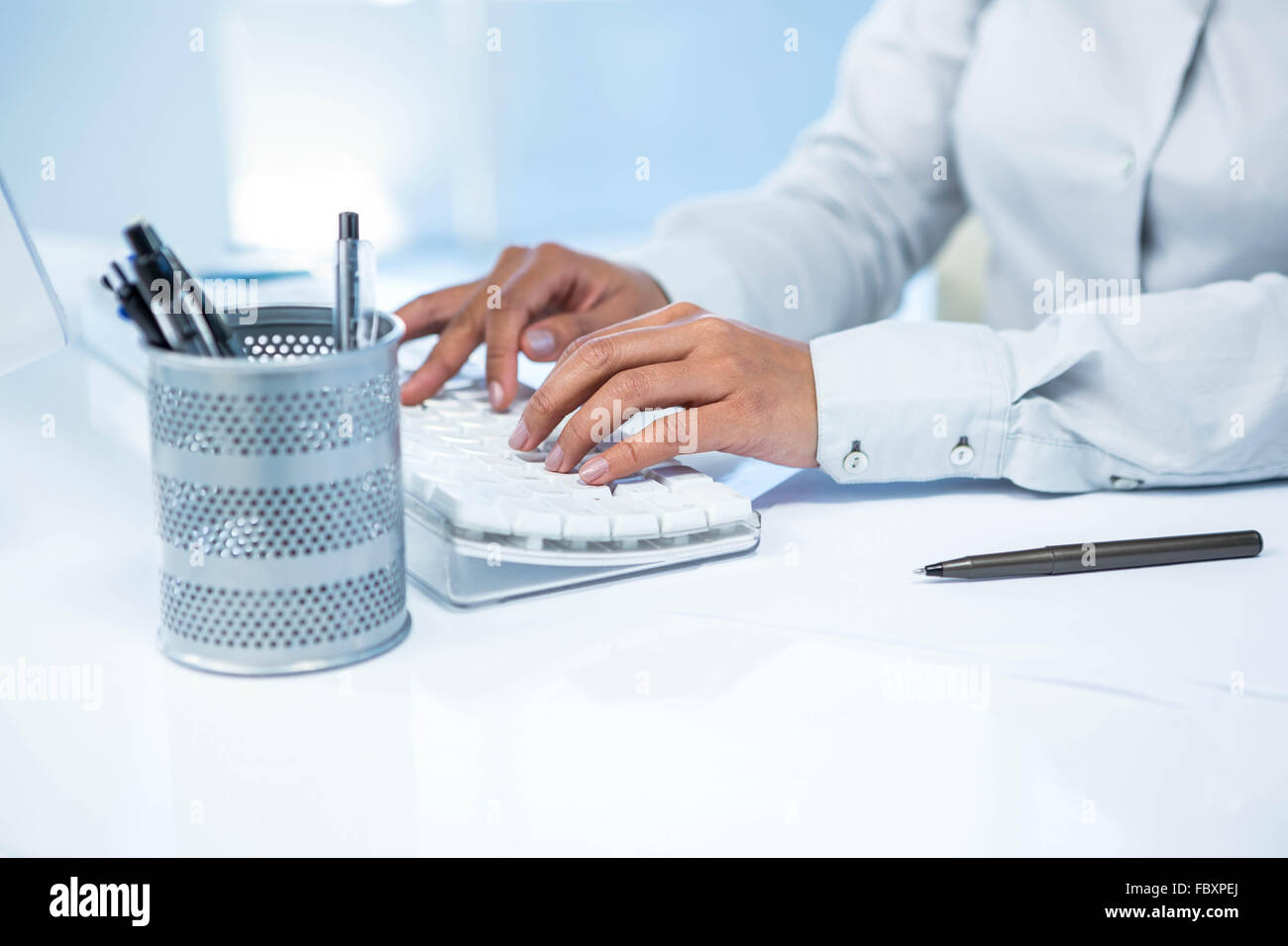 Businesswomans hands typing on computer keyboard Stock Photo - Alamy